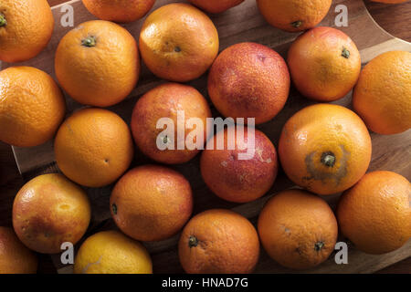 Sweet red orange heap over the table Stock Photo - Alamy