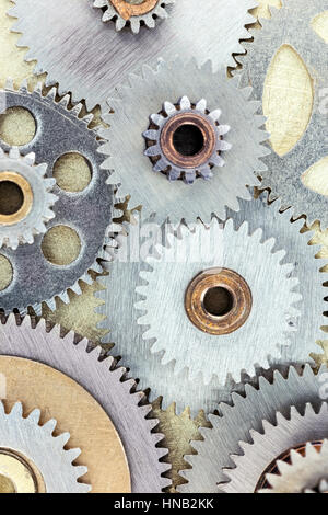 A detailed view of a metal gear wheel showing intricate teeth and gears ...
