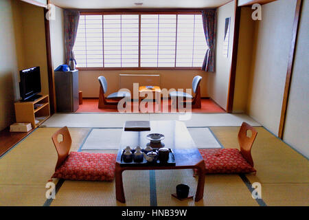 Traditional Japanese style hotel room with tatami mats and futon bed ...