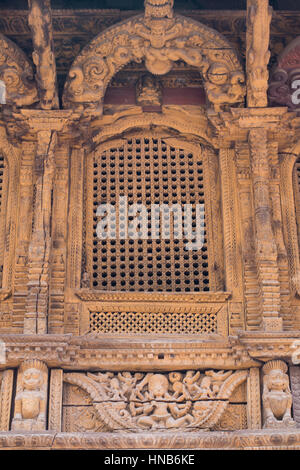 Carved wooden window with lattice work in the traditional Nepalese ...