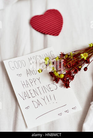 Valentines day concept with paper flowers, candy sweet hearts, gift box ...