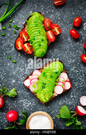 Sandwiches with avocado close-up. A vegetarian snack for a party or ...