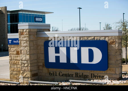 A logo sign outside of the headquarters of HID Global in Austin, Texas ...