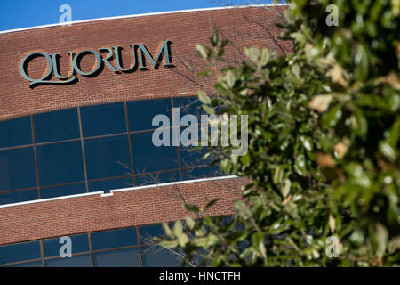 A logo sign outside of the headquarters of Quorum Health Resources in ...