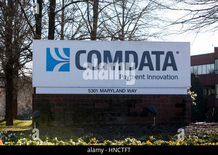 A logo sign outside of the headquarters of Comdata in Brentwood ...