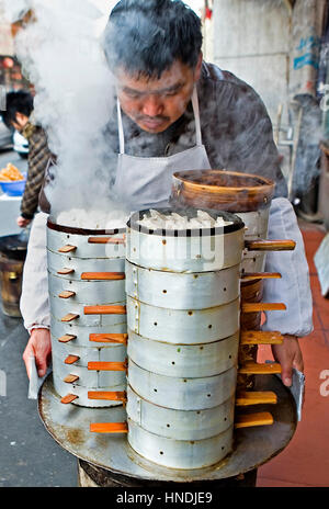 Cooking & selling dumplings, in Dazhalan Jie,Beijing, China Stock Photo ...