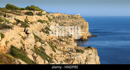 View of the cliffs and lighthouse at Cap Blanc, Mallorca Stock Photo ...