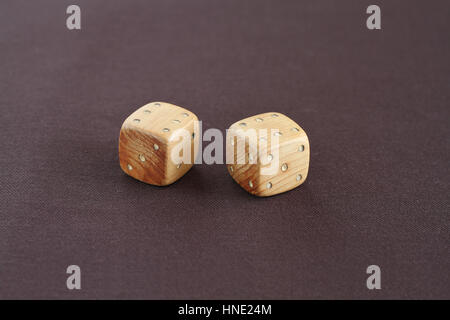 Purple game dices on lilac background Stock Photo - Alamy