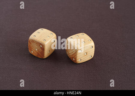 Purple game dices on lilac background Stock Photo - Alamy