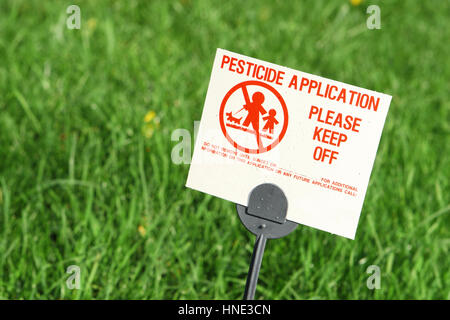 Pesticide Application warning sign on a stick in a lawn in Florida USA ...