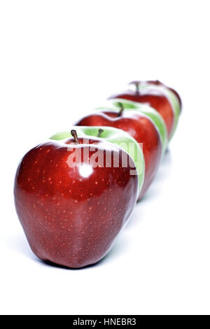 Row of juicy ripe apples on green background Stock Photo - Alamy