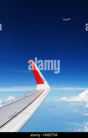 Oncoming flight traffic in mid air. Aircraft flying above earth ...