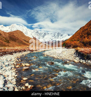 Snowy mountains and noisy mountain river. Georgia, Svaneti. Euro Stock ...