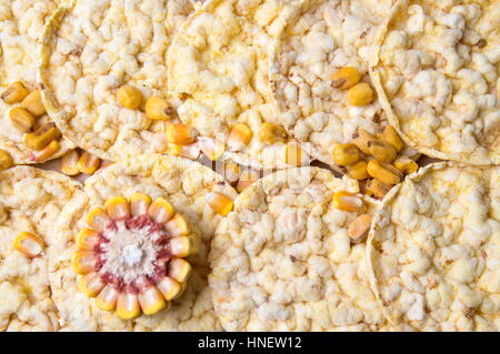 Circle shaped salty corn snacks making background Stock Photo - Alamy