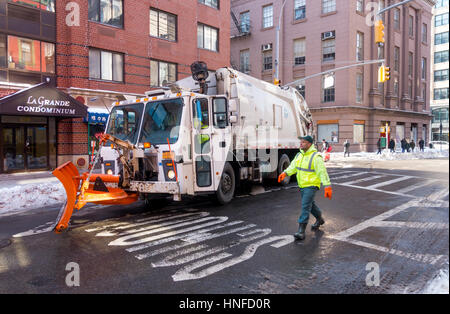 New York City sanitation worker cleaning up after a parade Stock Photo ...