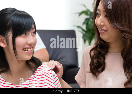 Family member enjoying conversation Stock Photo - Alamy