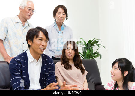 Family member enjoying conversation Stock Photo - Alamy