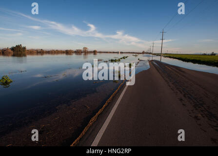 Newman, CA, USA. 12th Feb, 2017. A group of people ride in a row boat ...
