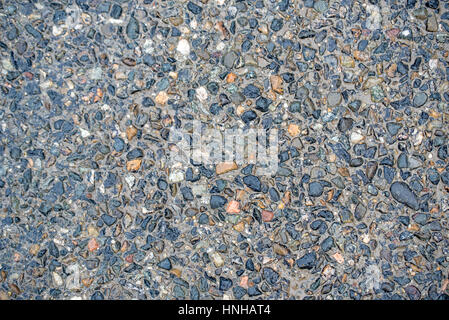 Texture of fragment of gray path made of masonry with sand in seams ...