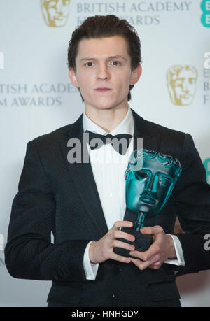 Tom Holland poses on the red carpet of the premiere for the movie ...