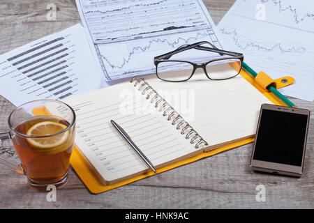 A cup of tea and empty notebook for sketch Stock Photo - Alamy