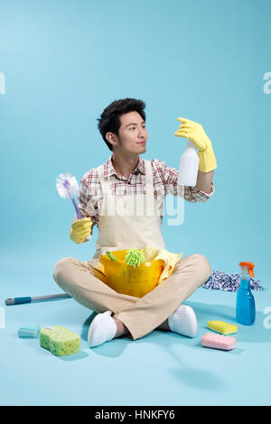 Young husband man cleaning floor at home Stock Photo - Alamy