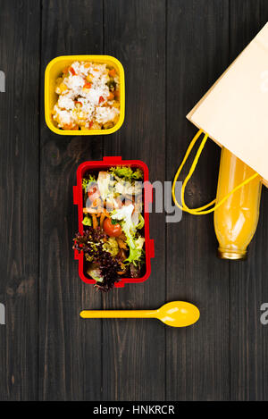 Lunch box bag, bottle of juice and apple on color background Stock ...