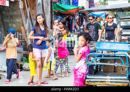 Street scene by Bangkerohan River and Bolton Bridge, Davao, Davao Del ...