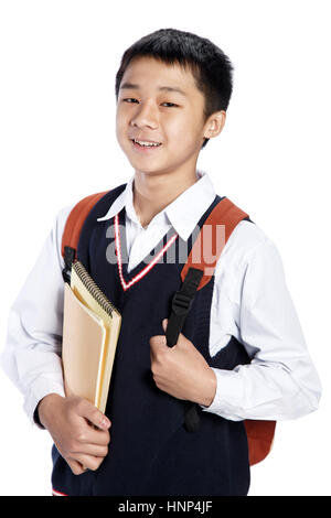 A middle school boy carrying a bag Stock Photo - Alamy