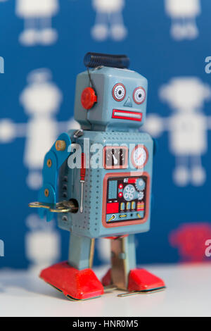 A vintage wind up toy robot, painted in blue and red Stock Photo - Alamy