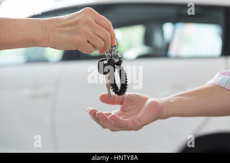 people's hand give and get car key with brown car background Stock ...