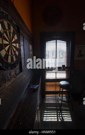 Gaming room with dart boards, daylight shot Stock Photo - Alamy