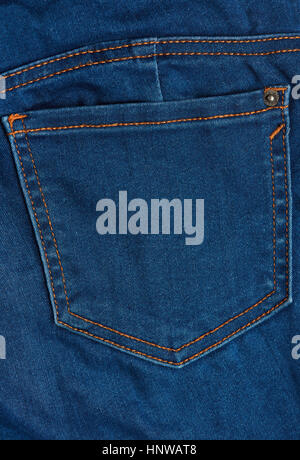 Dark blue jeans back pocket isolated on white background. Closeup of ...