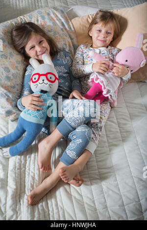 GIRL HUGGING TOYS Stock Photo - Alamy