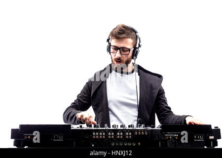 Trendy male dj posing against mixing console Stock Photo - Alamy