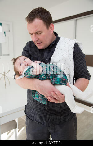 Father trying to settle baby Stock Photo - Alamy