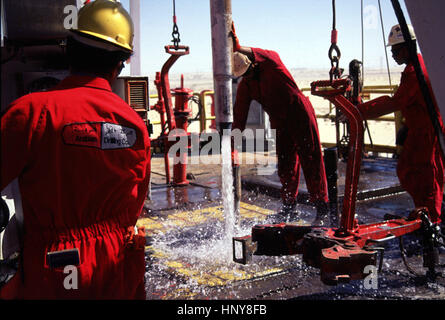 Oil rig drill floor action on an oil and gas exploration rig in the ...