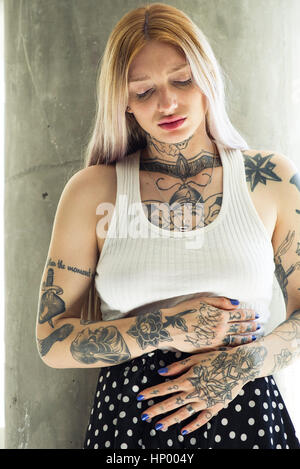 Young blonde woman holding menstrual cup screaming proud, celebrating ...