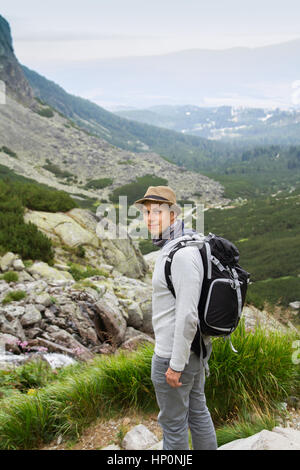 young hiker man in mountains. summer trekking path Stock Photo - Alamy