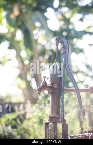Traditional hand operated water pump in the old town market square in ...