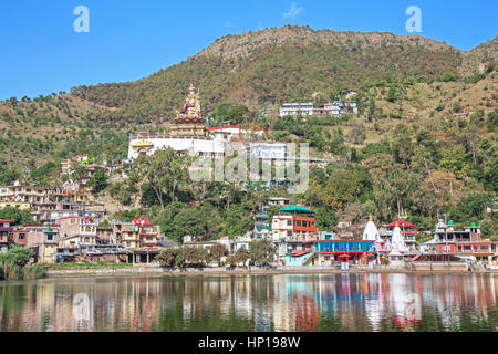 Sacred Rewalsar lake with big golden statue of Padmasambhava at the top ...
