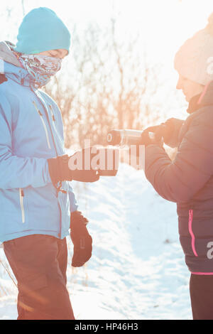 Break for hot drink during the winter trip Stock Photo - Alamy
