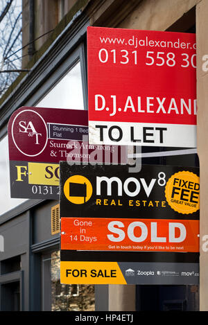 a selection of estate agents signs for sale and sale agreed Stock Photo ...