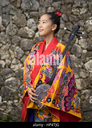 Okinawa musician Nayuta Hirano with sanshin (instrument) and ...