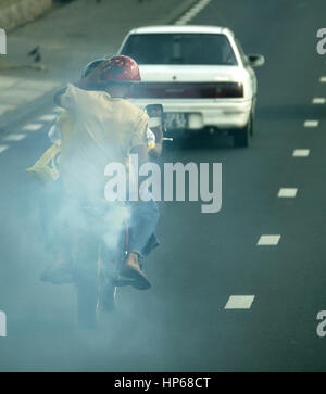 Pollution, exhaust fumes, street scene, moped driver, Mauritius, air ...