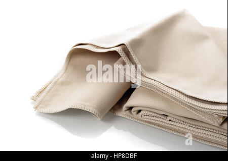 closeup folded microfiber towel on brown leather background Stock Photo ...