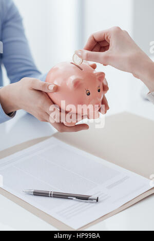 Concept of money protection with financial advisor holding an umbrella ...
