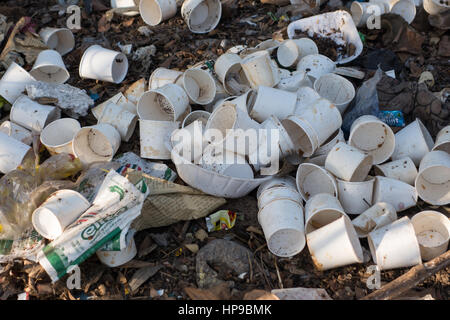 A pile of used paper cups in a trash bin Stock Photo - Alamy