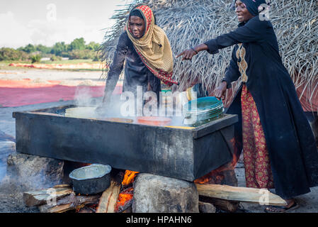 Women prepare anchovies, locally called Dagaa, for drying at Mkokotoni ...