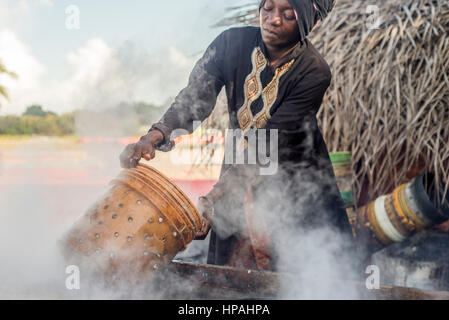 Women prepare anchovies, locally called Dagaa, for drying at Mkokotoni ...